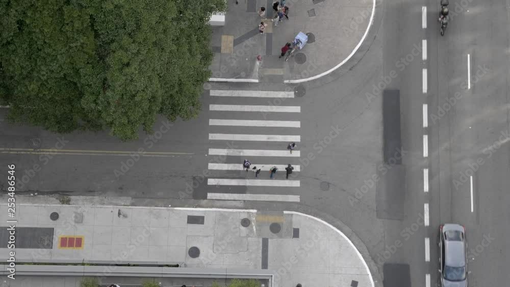 Birds eye view of pedestrians crossing, road markings on road surface ...