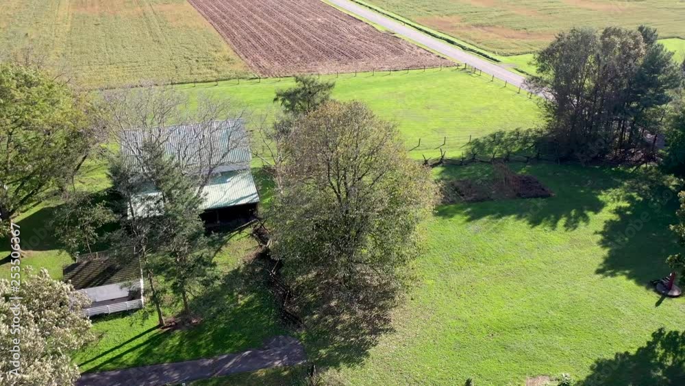 Aerial flyover blacksmith building and barn Herr House, a historical ...