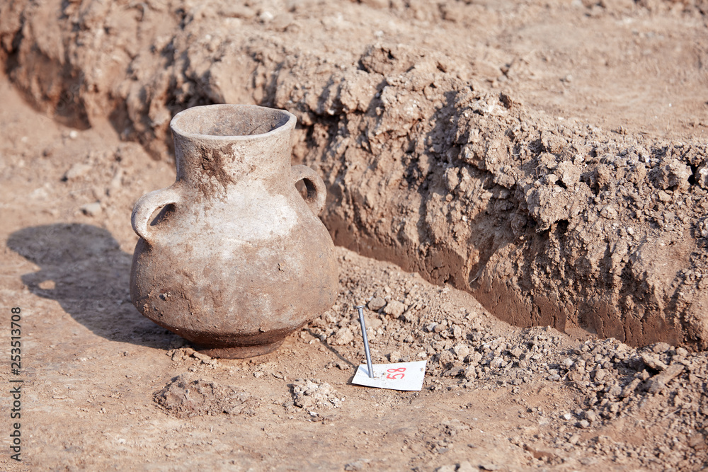 Archaeological excavations. Found artefact, aged damaged ceramic jar on ...