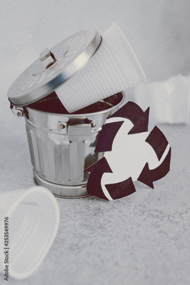disposable cups and garbage bin with recycle symbol, concept of ...