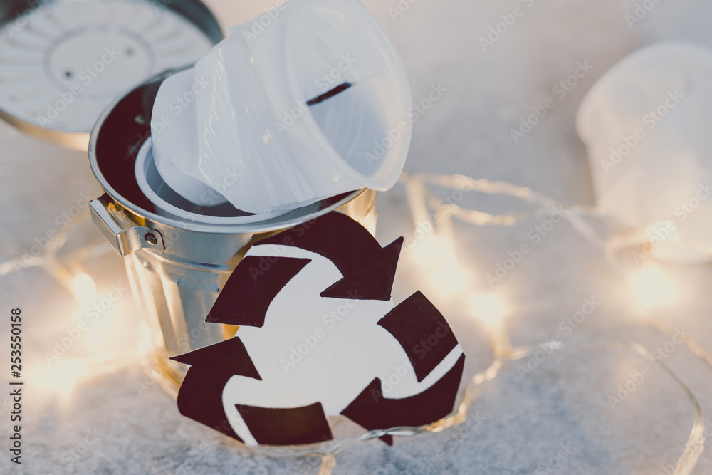 disposable cups and garbage bin with recycle symbol, concept of ...