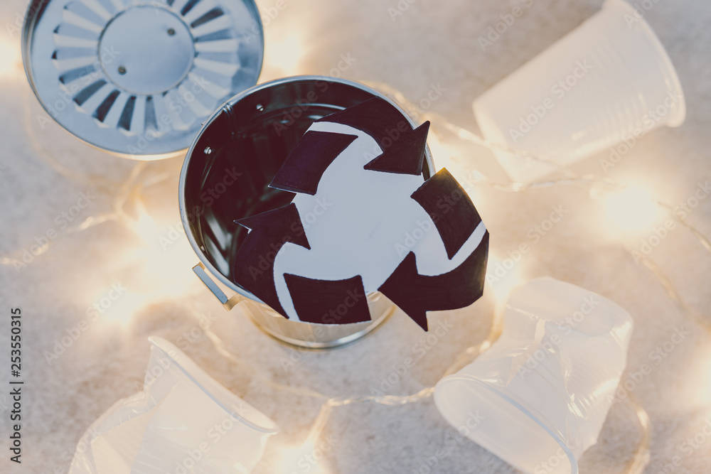 disposable cups and garbage bin with recycle symbol, concept of ...