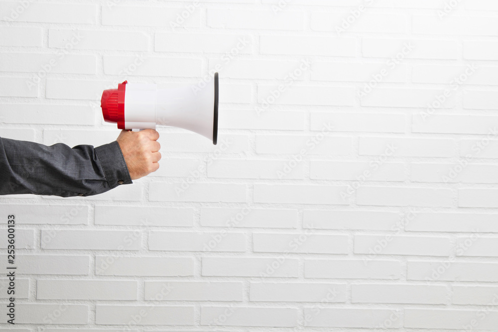 hand with isolated megaphone on white background Stock Photo | Adobe Stock