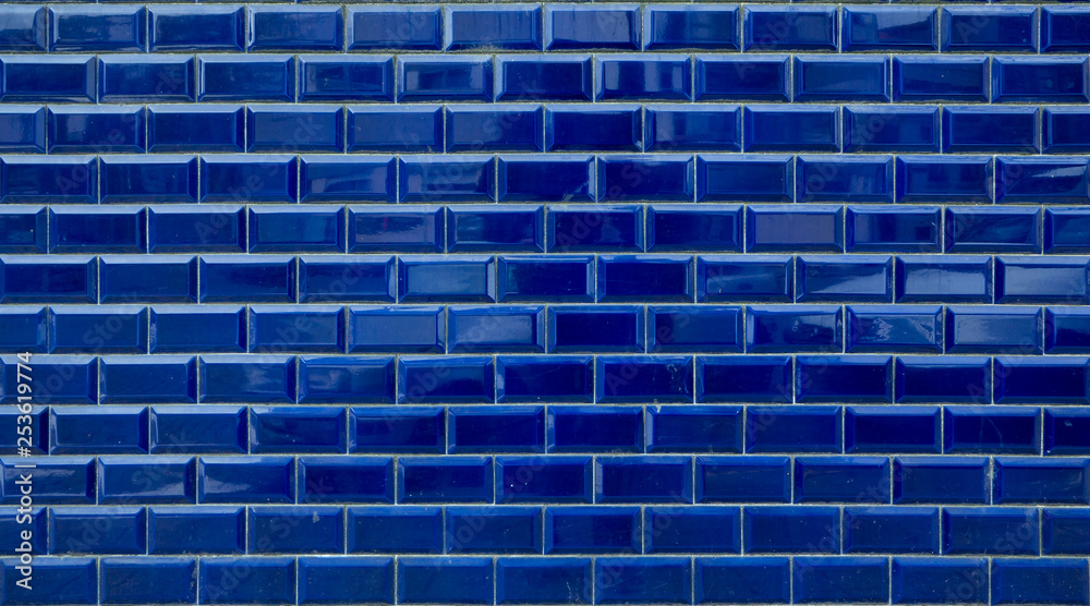 Shiny blue brick tiles on wall. Background texture Stock Photo | Adobe ...