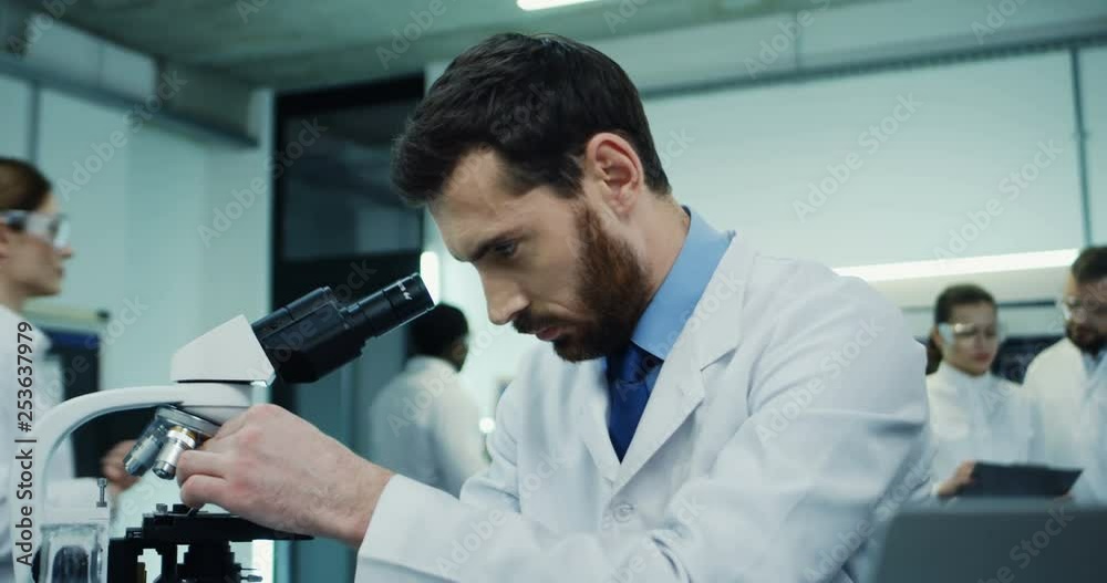 Portrait handsome Caucasian man scientist doing some investigation at ...