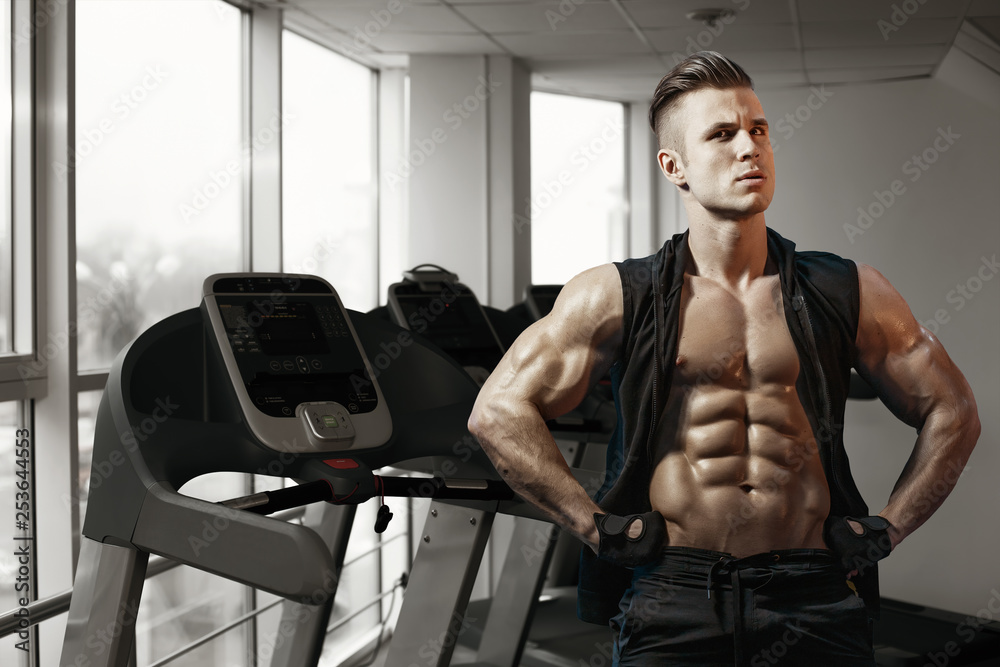 Muscular Model Young Man Exercising In Gym Portrait Of Sporty Strong