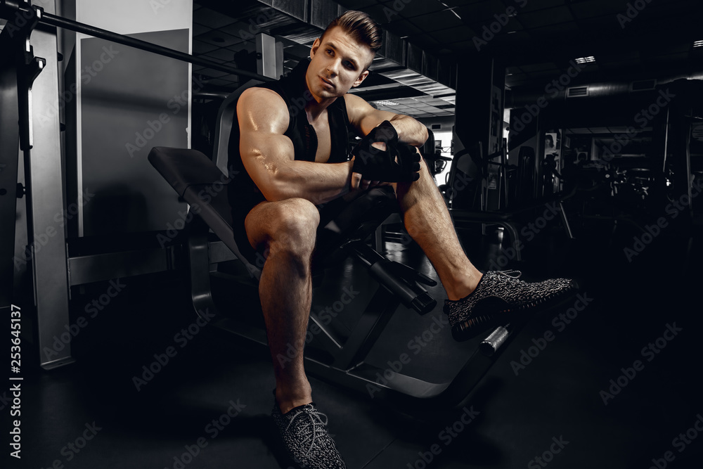 Muscular Model Young Man Exercising In Gym Portrait Of Sporty Strong