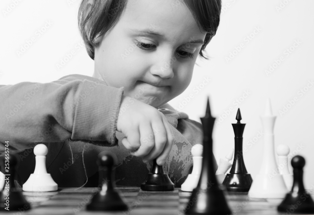 Humorous photo of little champion. Beautiful child girl learns to play ...