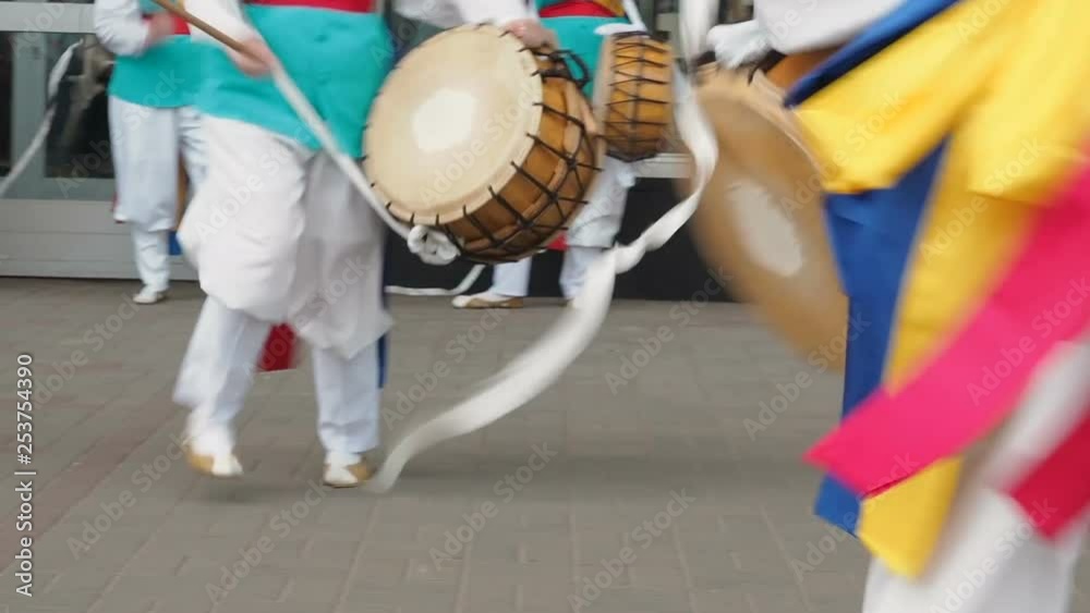 Korean national festival. A group of musicians and dancers in bright ...