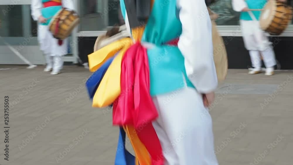 Korean national festival. A group of musicians and dancers in bright ...