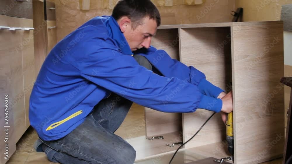 working Assembly a curbstone ,installation of doors for furniture Stock ...