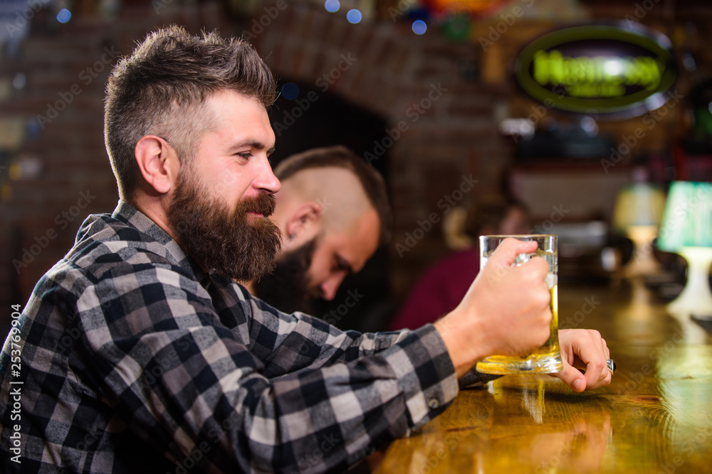Man with beard spend leisure in dark bar. Brutal hipster bearded man ...