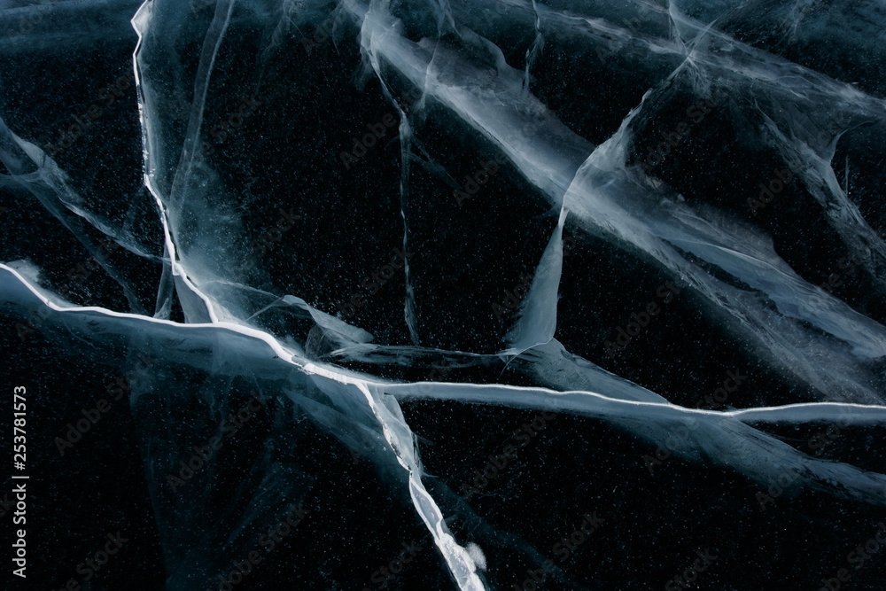 Cracked icy dark blue ice texture for your background design or ...