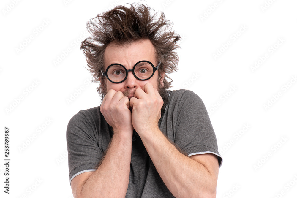 Crazy Scared Man with funny Haircut in eye Glasses, bites his nails and ...