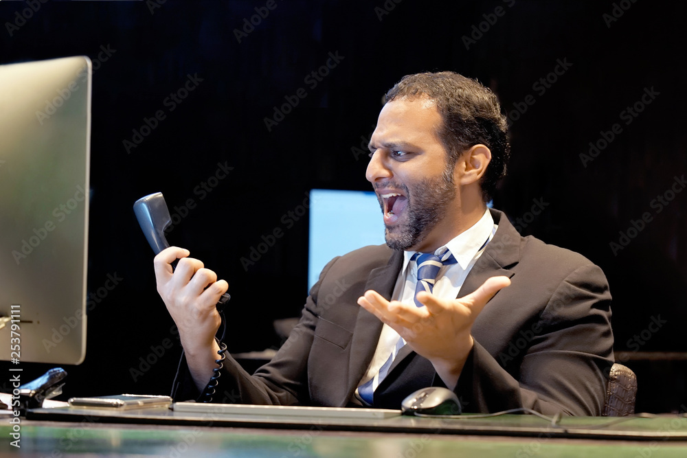 A office bearded man in stress. An office worker a man shouting in the ...