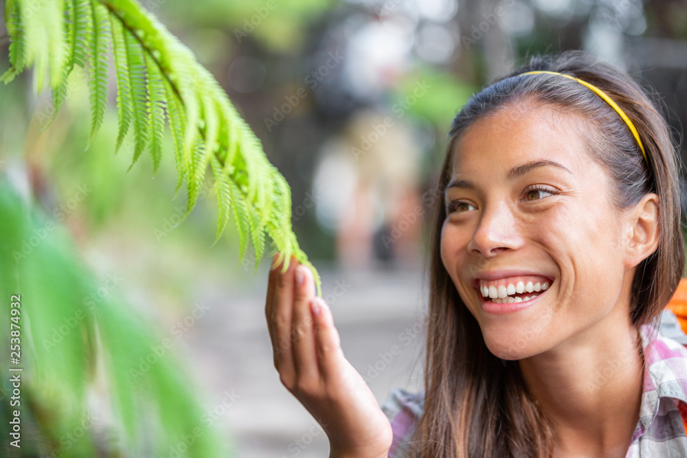 Foto de Nature interpretation park guide woman touching plants for ...