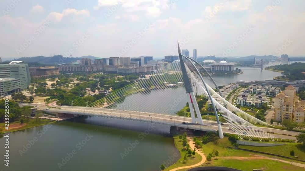 Seri Wawasan Bridge or Putra Bridge and Putrajaya Lake with blue sky ...