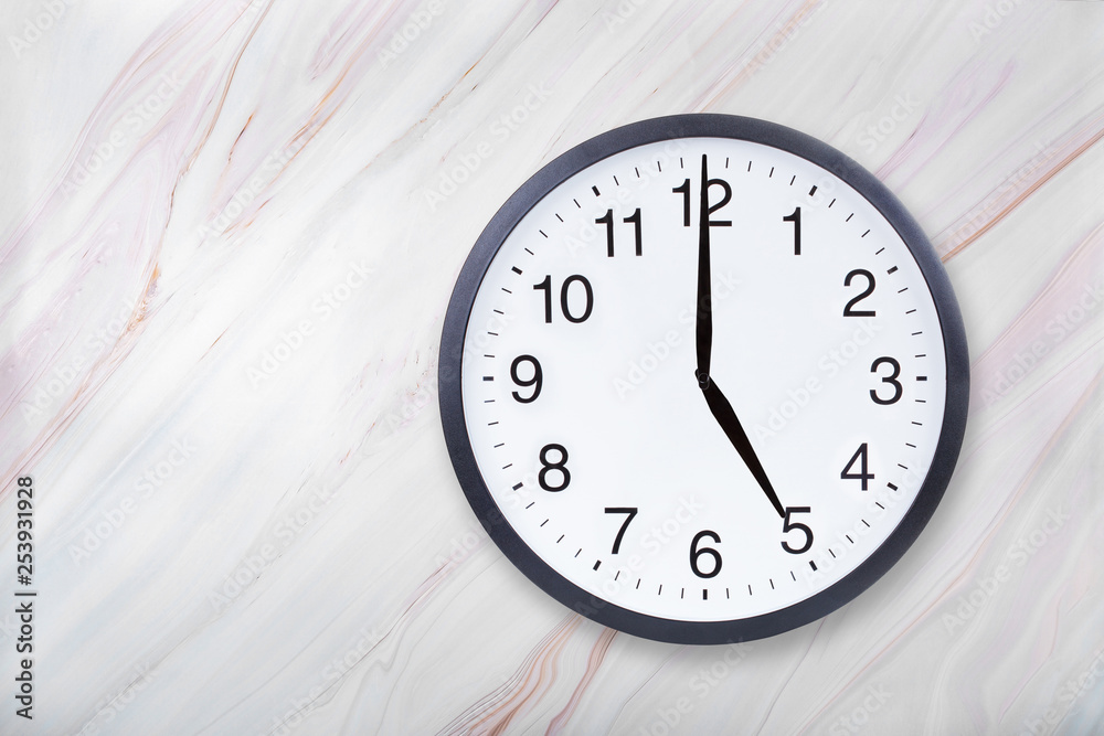 Wall clock show five o'clock on marble texture. Office clock show 5pm ...