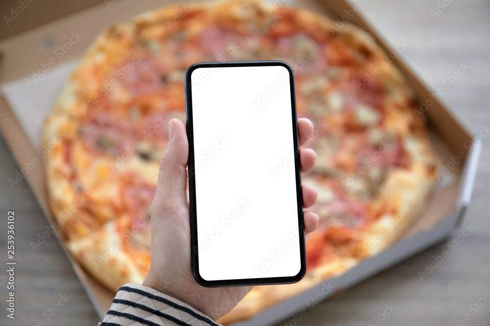 holding phone with isolated screen above pizza box Stock Photo | Adobe ...