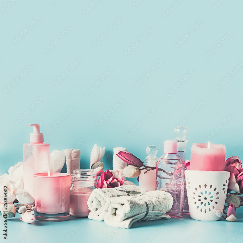 Spa background with towels, flowers, candles and body care cosmetics at ...
