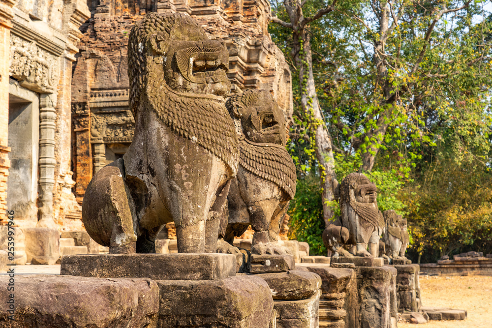 Preah Ko temple, Cambodia: Khmer style guardian lions sculptures Stock ...