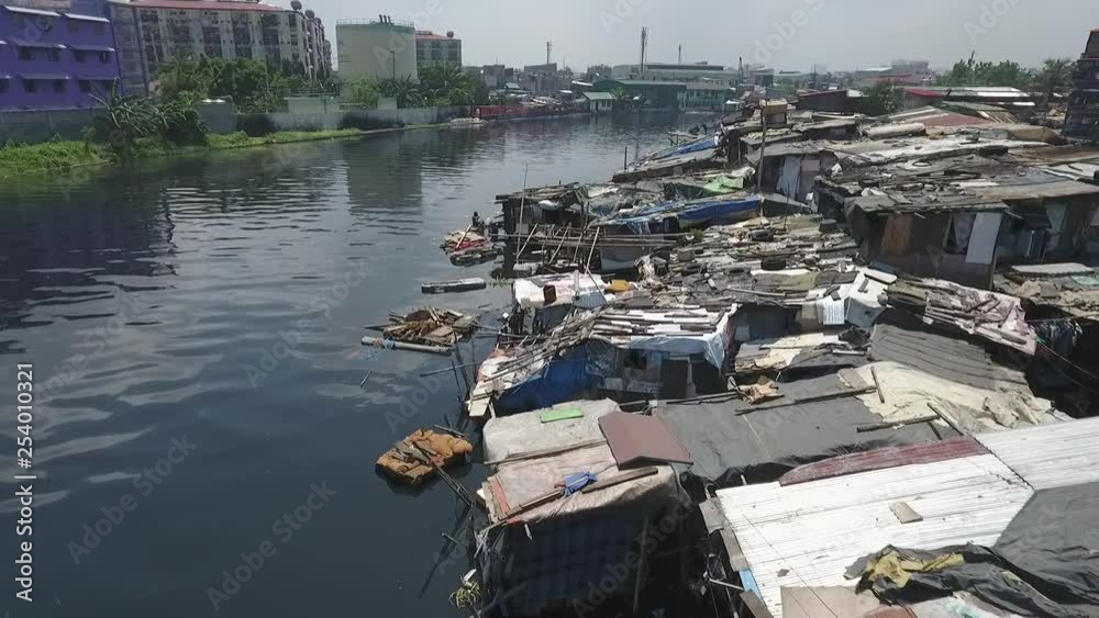 Aerial of Slum Area along the polluted canal in Tondo Manila ...