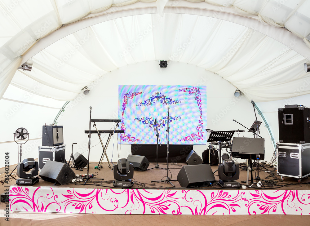 Rock concert stage with musical instruments prepared for the musicians ...