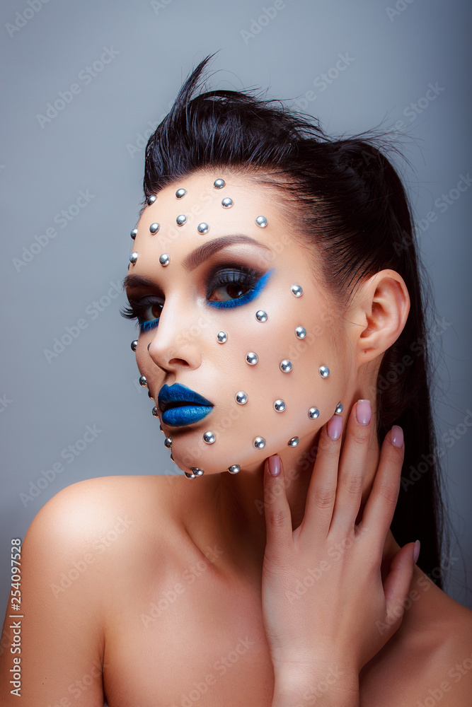 Makeup in the style of beauty. Bright lips and eyes. Portrait of a ...