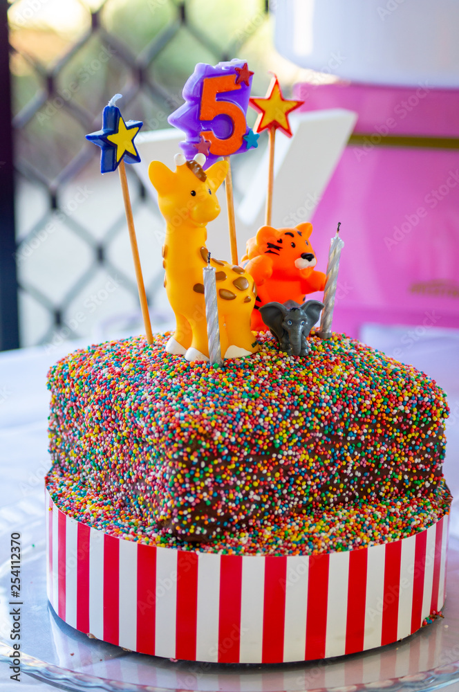 5th birthday cake with candles Stock Photo | Adobe Stock