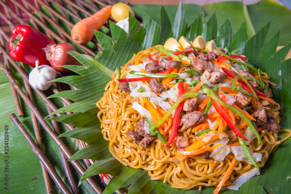 Pancit Guisado Bilao - Filipino noodles Bilao Stock Photo | Adobe Stock