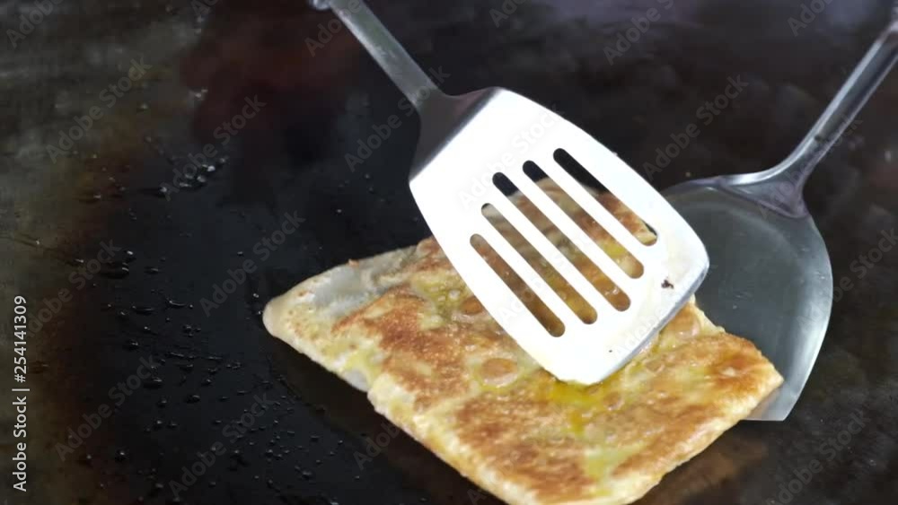 Roti fried on pan - mix egg, vegetable and chicken with roti dough ...