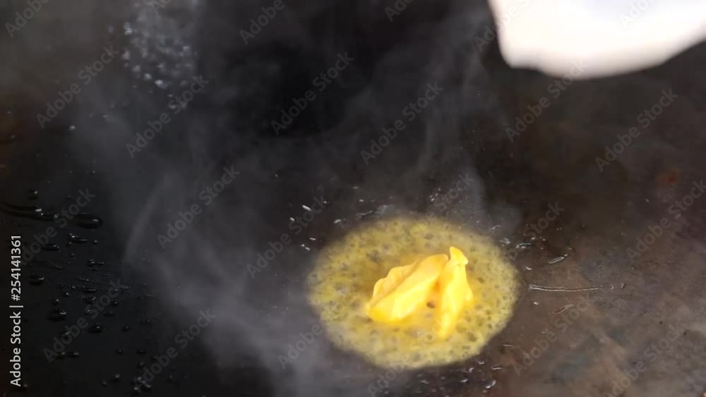 Roti fried on pan - mix egg, vegetable and chicken with roti dough ...