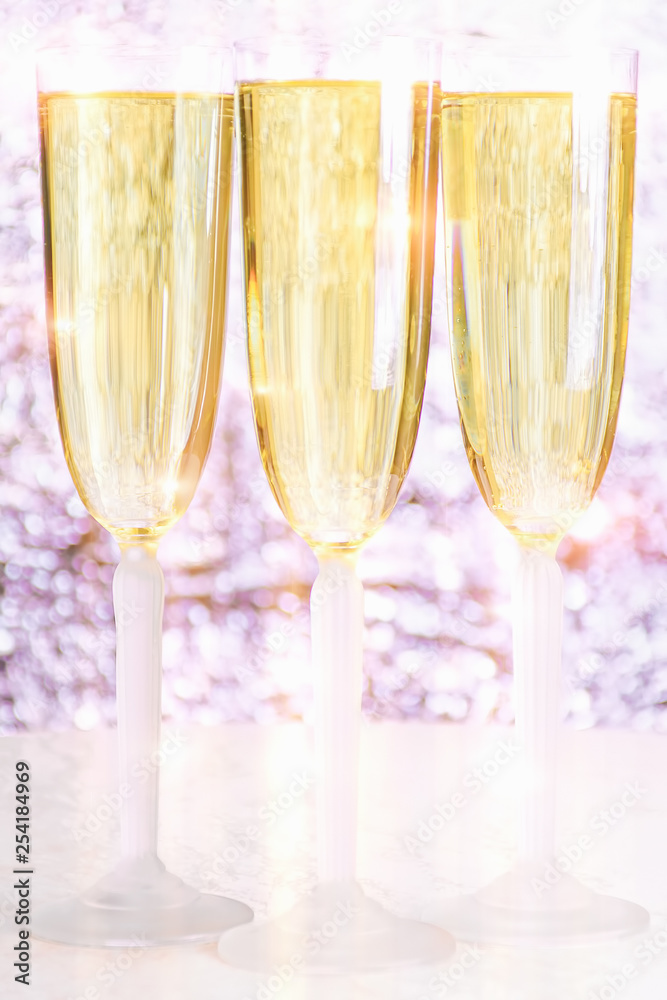 Three glasses of champagne with white frosted in the form of ancient ...