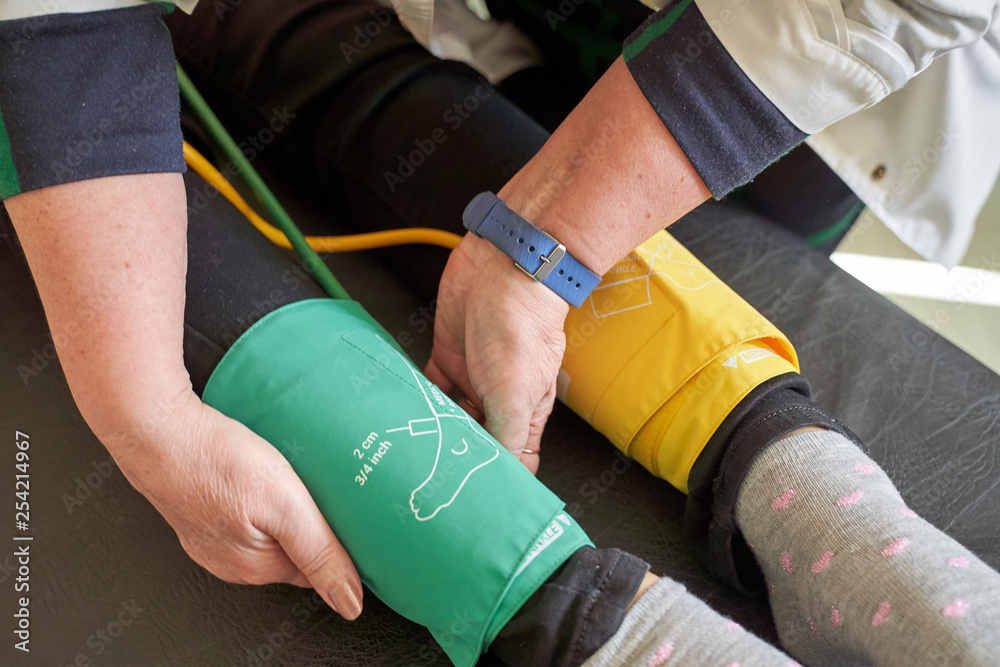 Foto de Peripheral artery disease measuring for patient ankle brachial ...