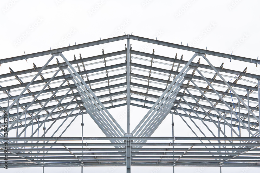 Structure of building from galvanized metal. Steel construction on sky ...