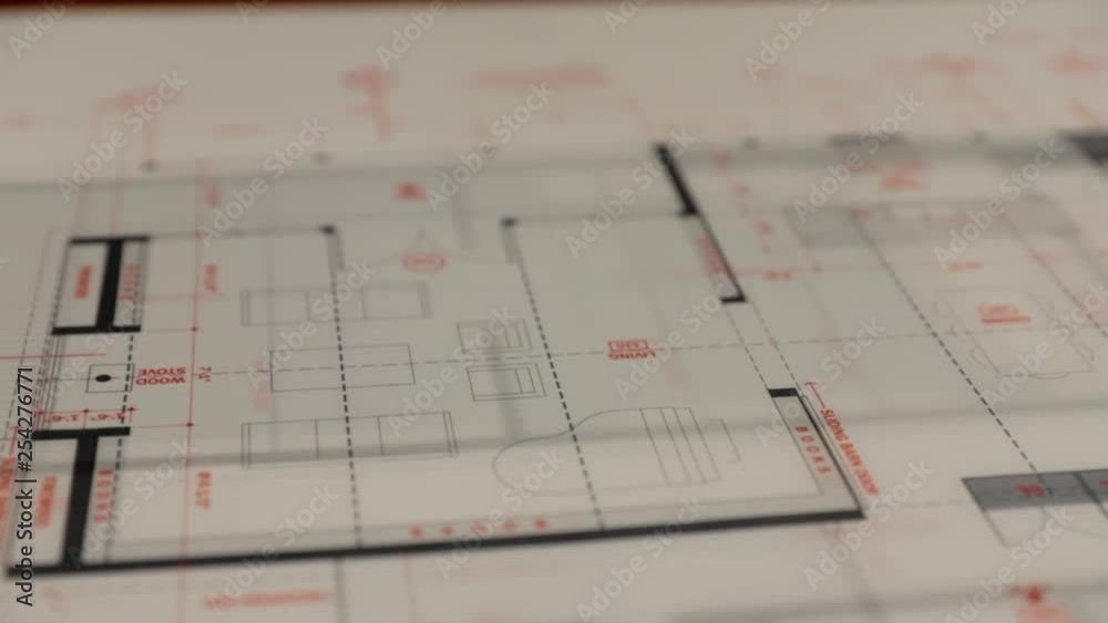 View of an architectural floor plan drawing laid flat on a table. Low ...