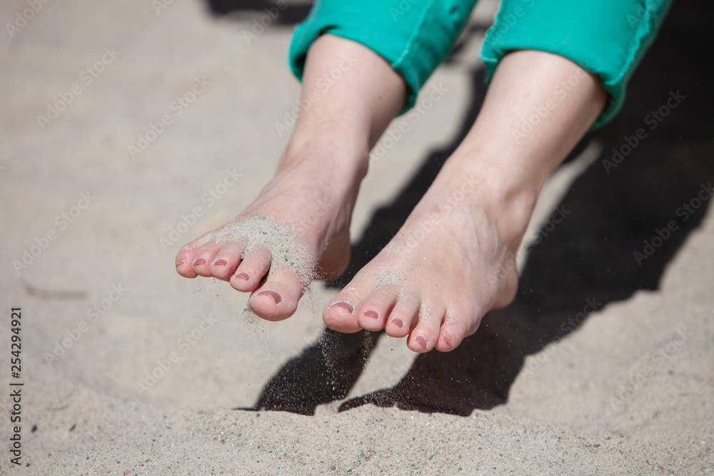 Woman's feet and toes playing in sand Stock Photo | Adobe Stock
