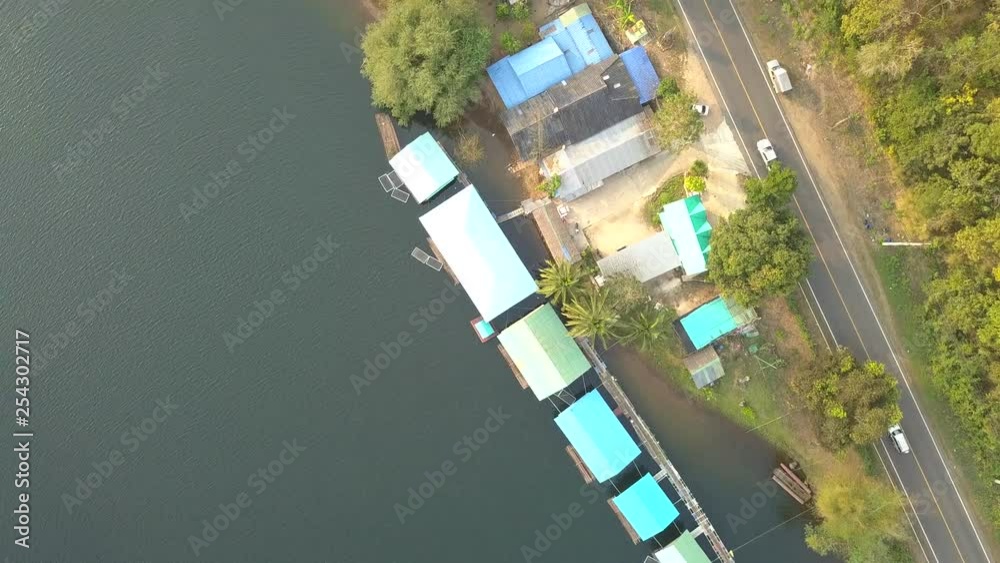 Done footage of water and highway. Flying high over a populated area ...