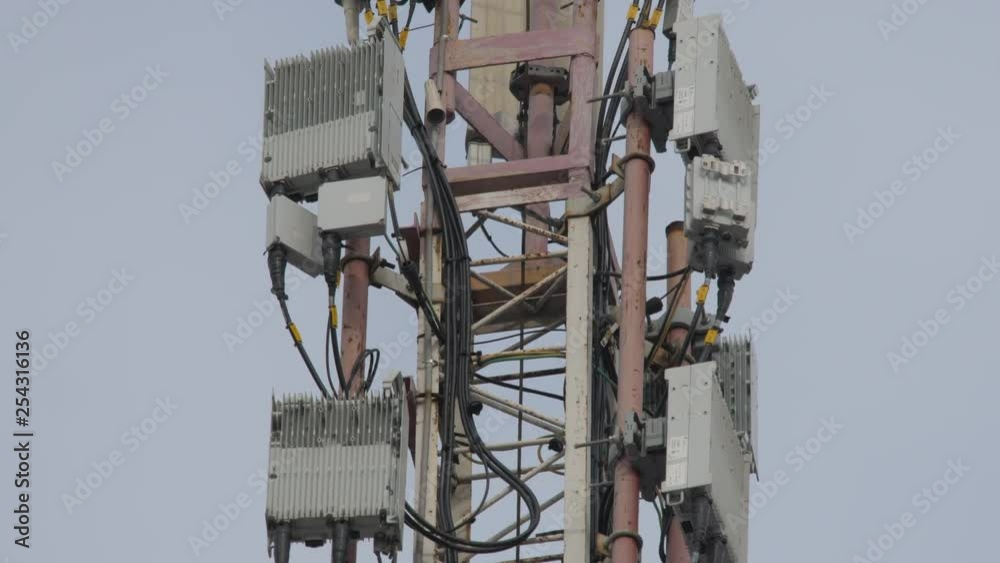 Telecommunication tower. Phone pole. Antenna on cloudy sky. Fibre ...