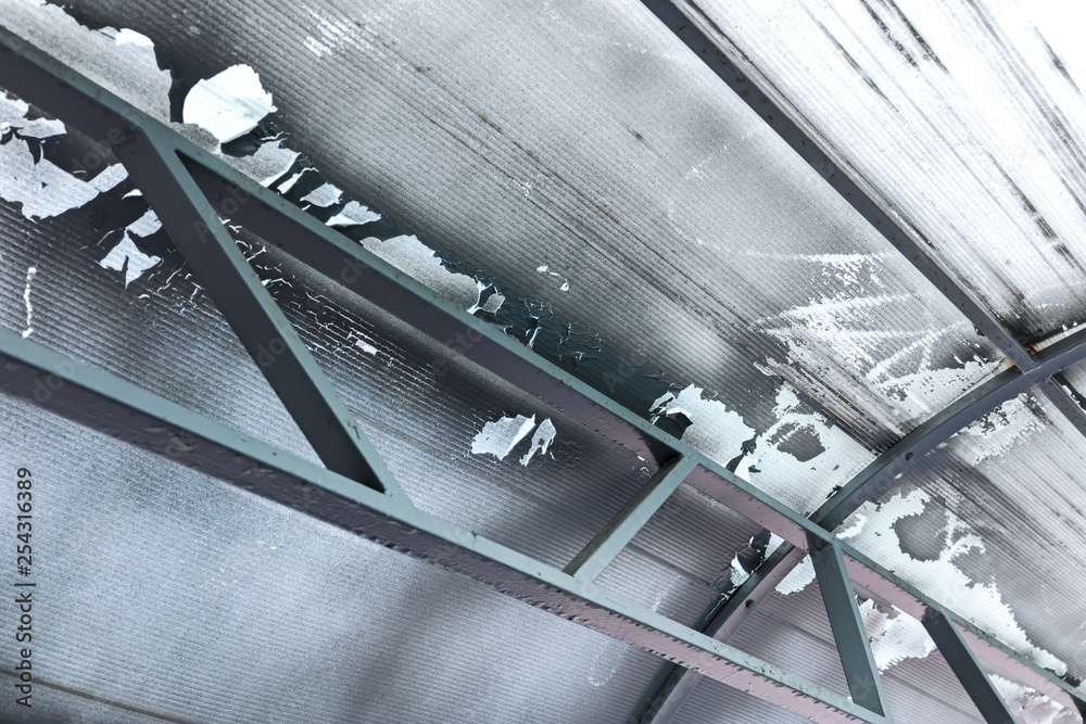 industrial ceiling structure with metal beams, bottom view. abstract ...