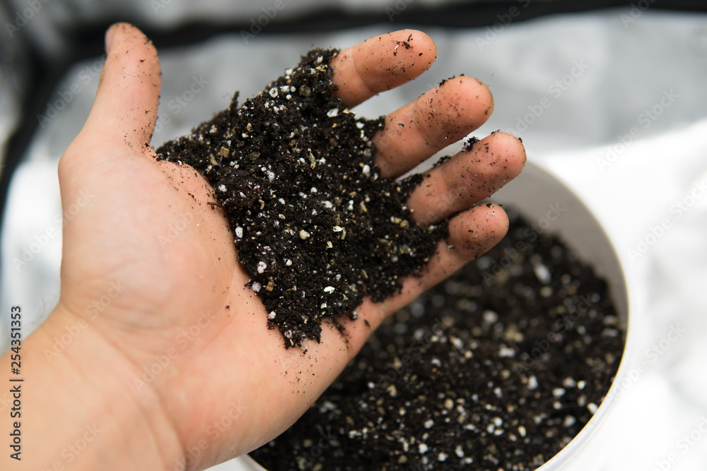 Foto de A mixture of earth, perlite and vermiculite. The concept of ...