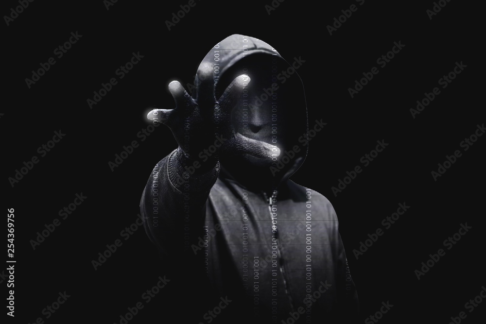 Hacker in black hoodie standing with open palms touch the digital ...