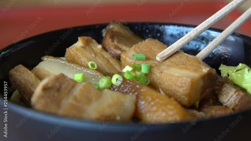 Slow Motion of people eating pork in a japanese restaurant. Using ...