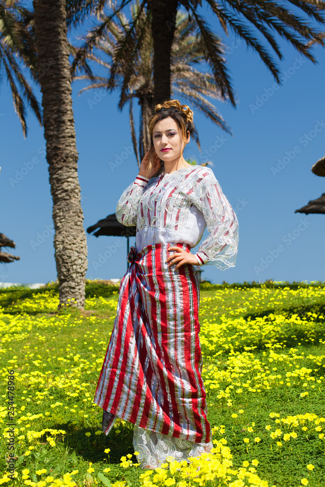 Muslim girl posing in traditional clothes outdoor Stock Photo | Adobe Stock