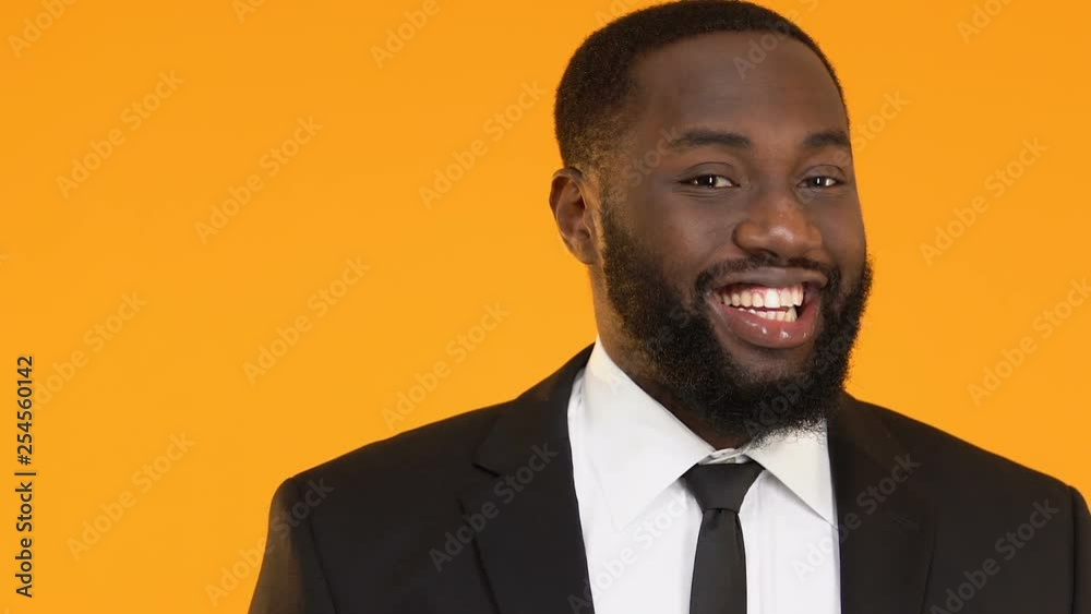 Glad man in suit waving hand to say hello, meeting important business ...