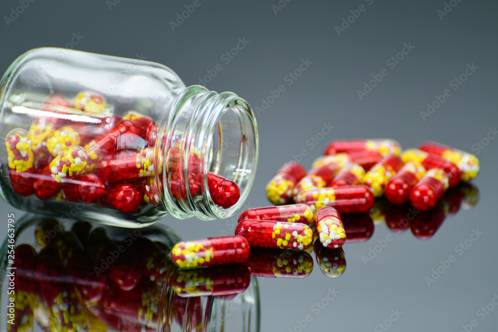 Pellets in transparent hard gelatin capsule on dark background. Stock ...