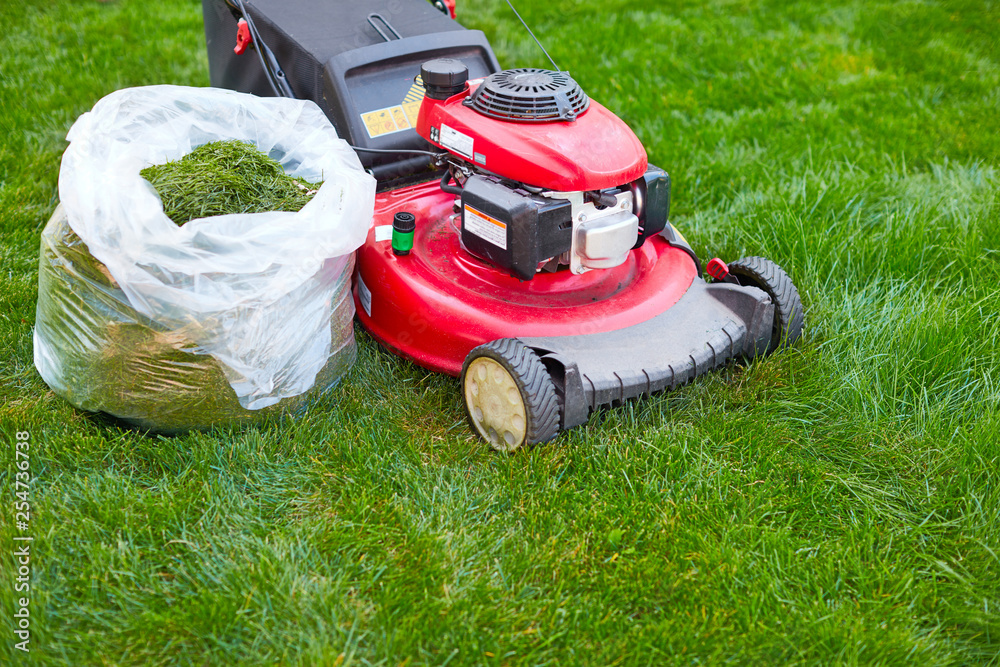 lawn mover on grass Stock Photo | Adobe Stock