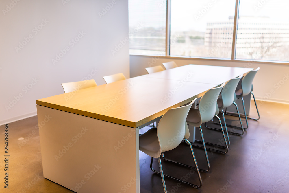 New modern office room in building with closeup of wooden meeting ...
