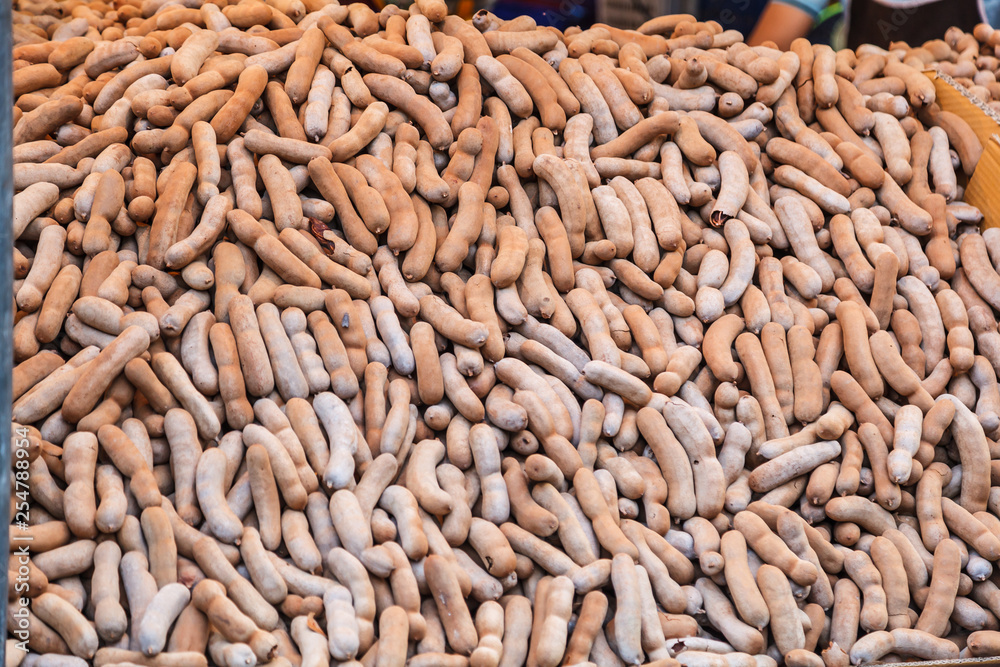 Tropical Tamarind fruit pod with hard brown shell contains edible ...