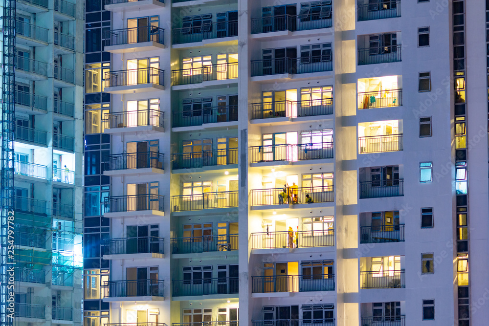 City apartment windows at night. Residential highrise residences for ...